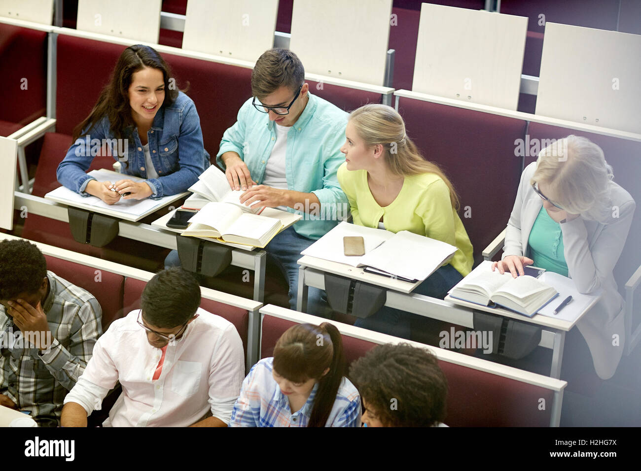 group of students with notebooks at lecture hall Stock Photo - Alamy