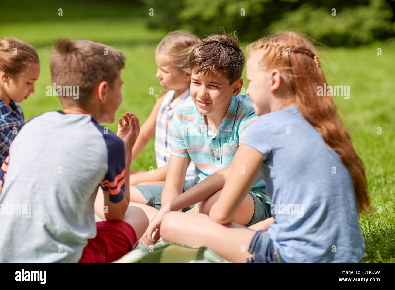 group of happy kids or friends outdoors Stock Photo - Alamy