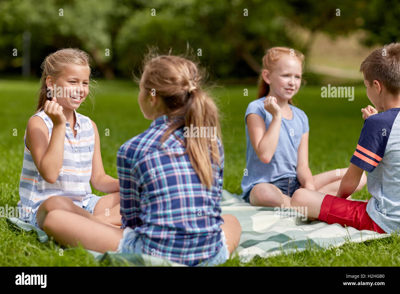 happy kids playing rock-paper-scissors game Stock Photo - Alamy