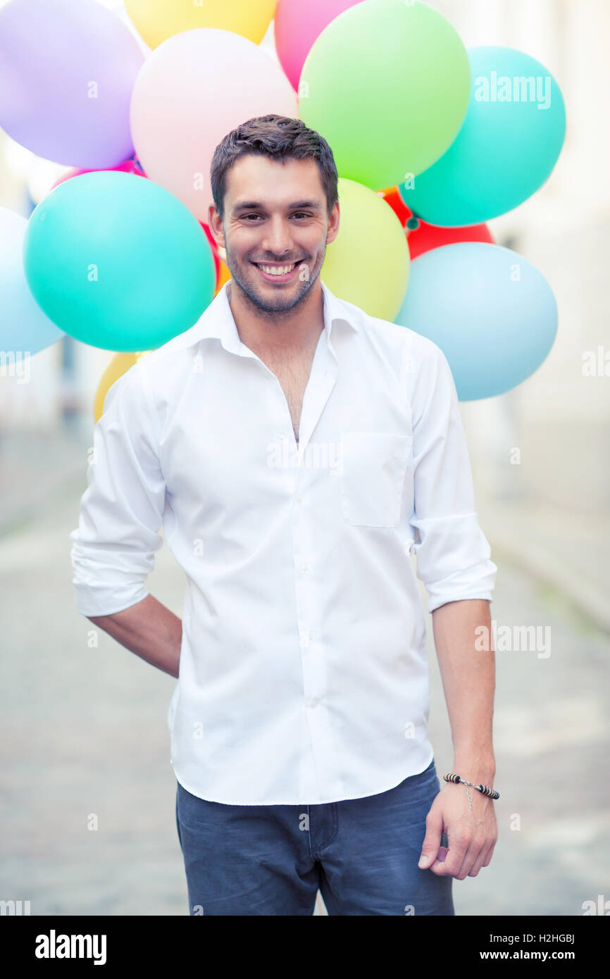 man with colorful balloons in the city Stock Photo - Alamy