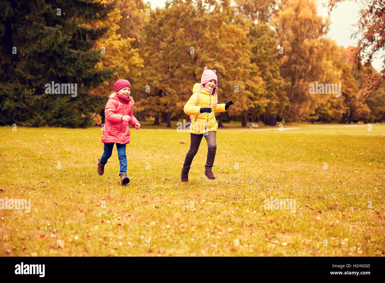 group of happy little girls running outdoors Stock Photo - Alamy