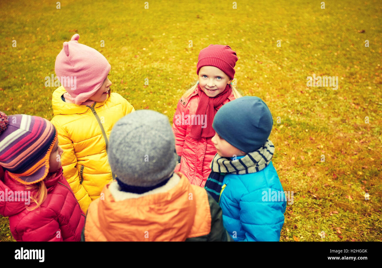 happy children standing in circle at autumn park Stock Photo - Alamy