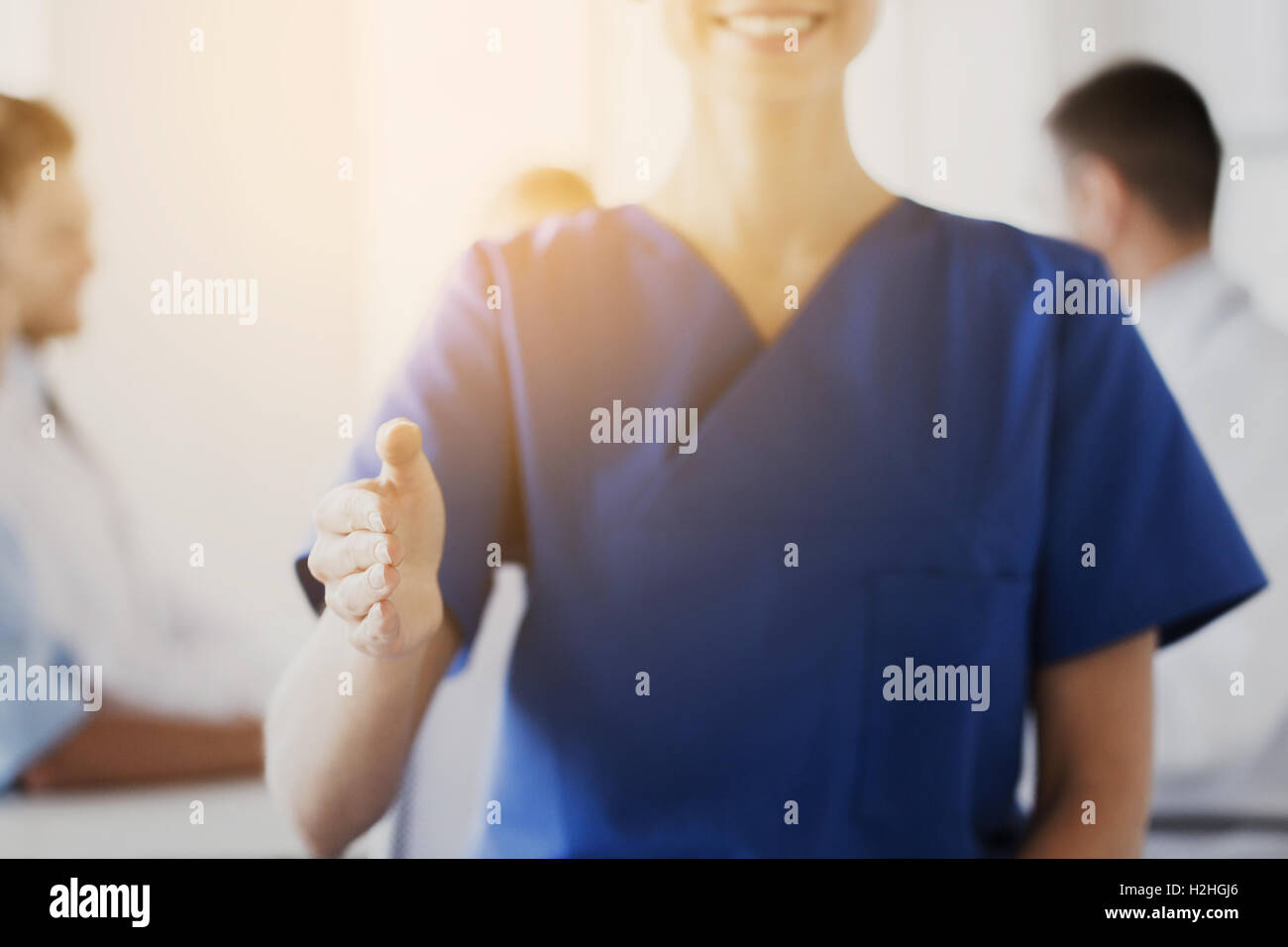 Happy doctor handshake nurse hi-res stock photography and images - Alamy