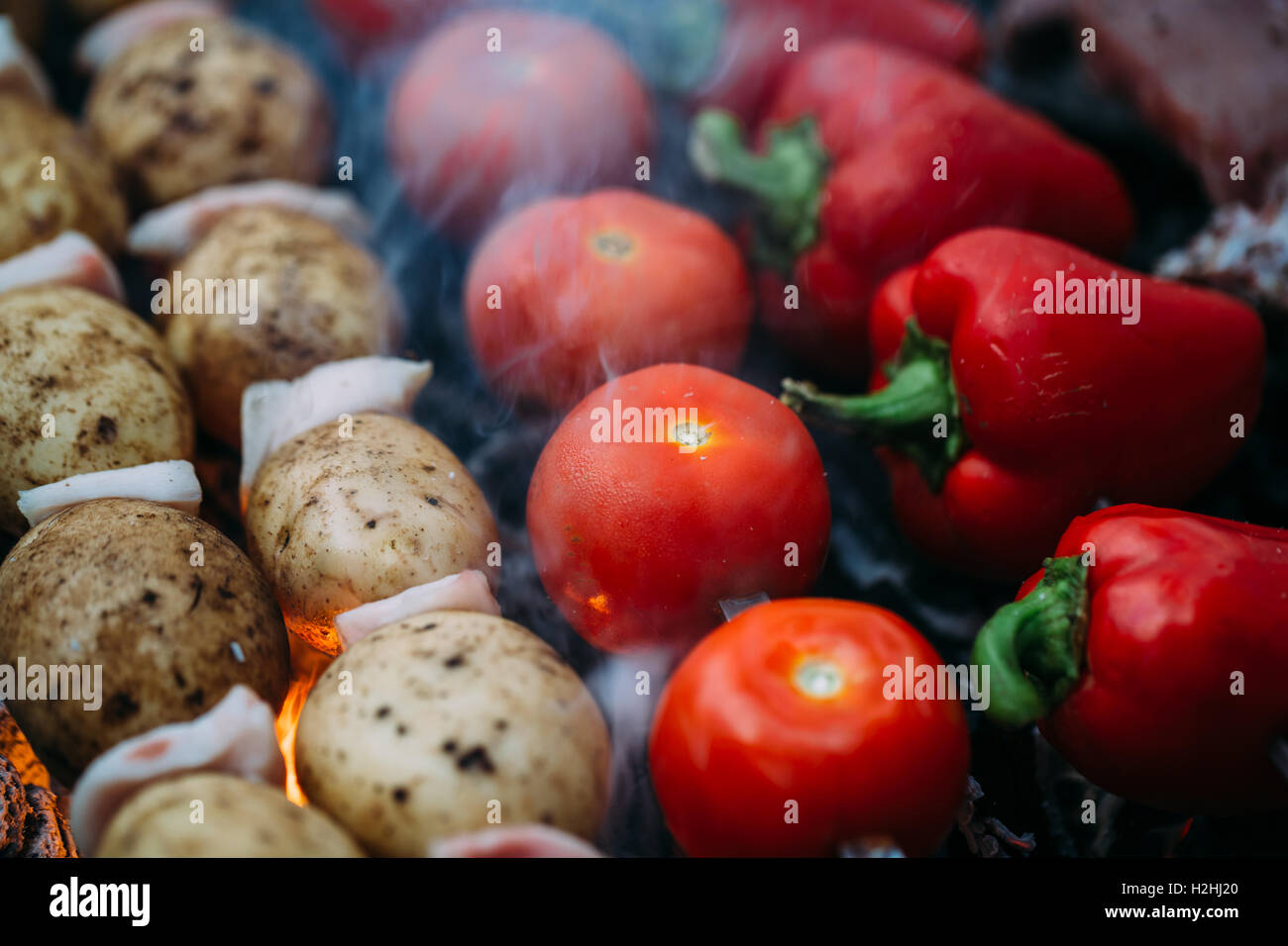 Veggies on barbeque tomatoes, red bell pepper, potatoes Stock Photo - Alamy