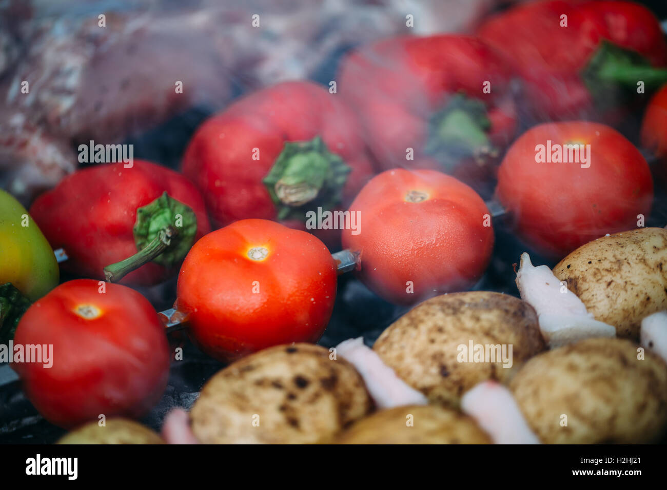 Veggies on barbeque tomatoes, red bell pepper, potatoes Stock Photo - Alamy