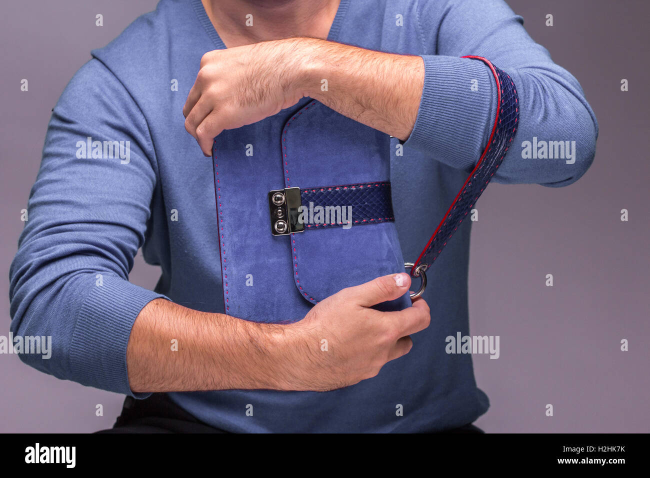 Modern blue bag in male hands Stock Photo - Alamy