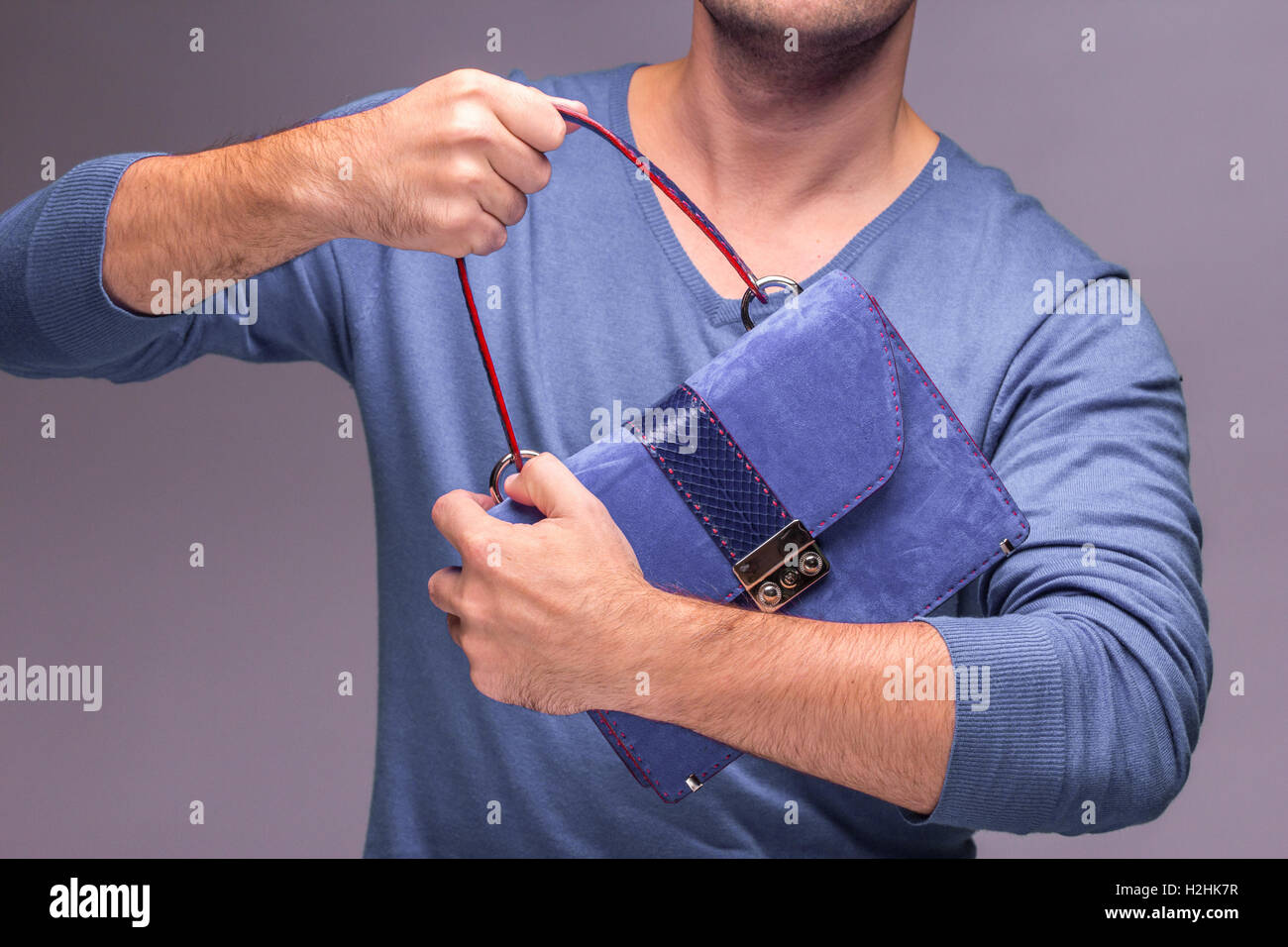 Modern blue bag in male hands Stock Photo - Alamy