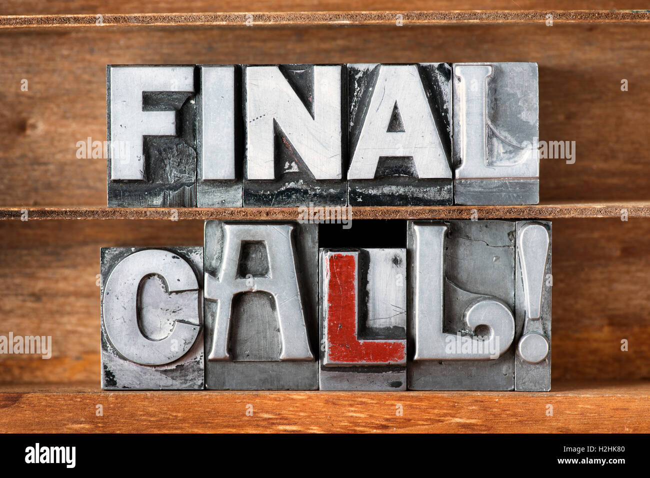 final call exclamation made from metallic letterpress type on wooden ...