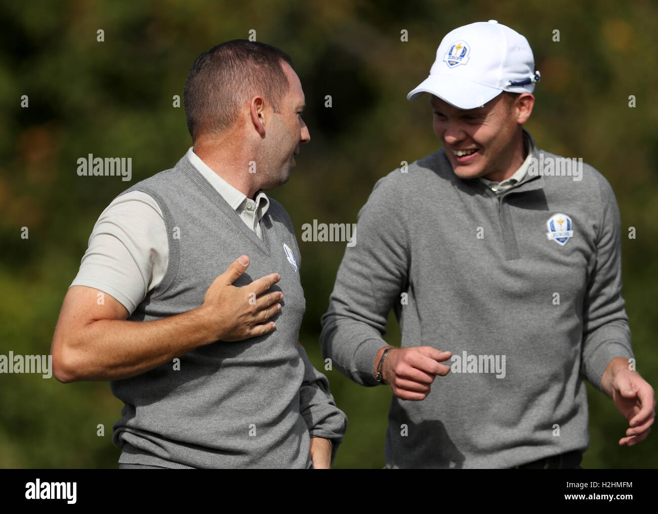 Europe's vice captain Sergio Garcia (left) talks with Danny Willett ...