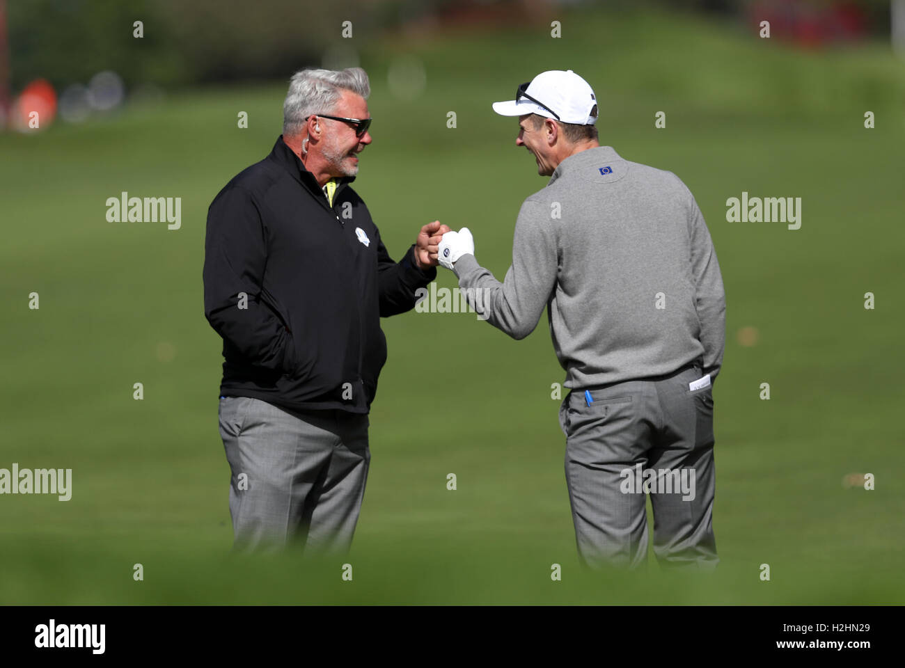Europe's Justin Rose (right) fist pumps captain Darren Clarke during a ...