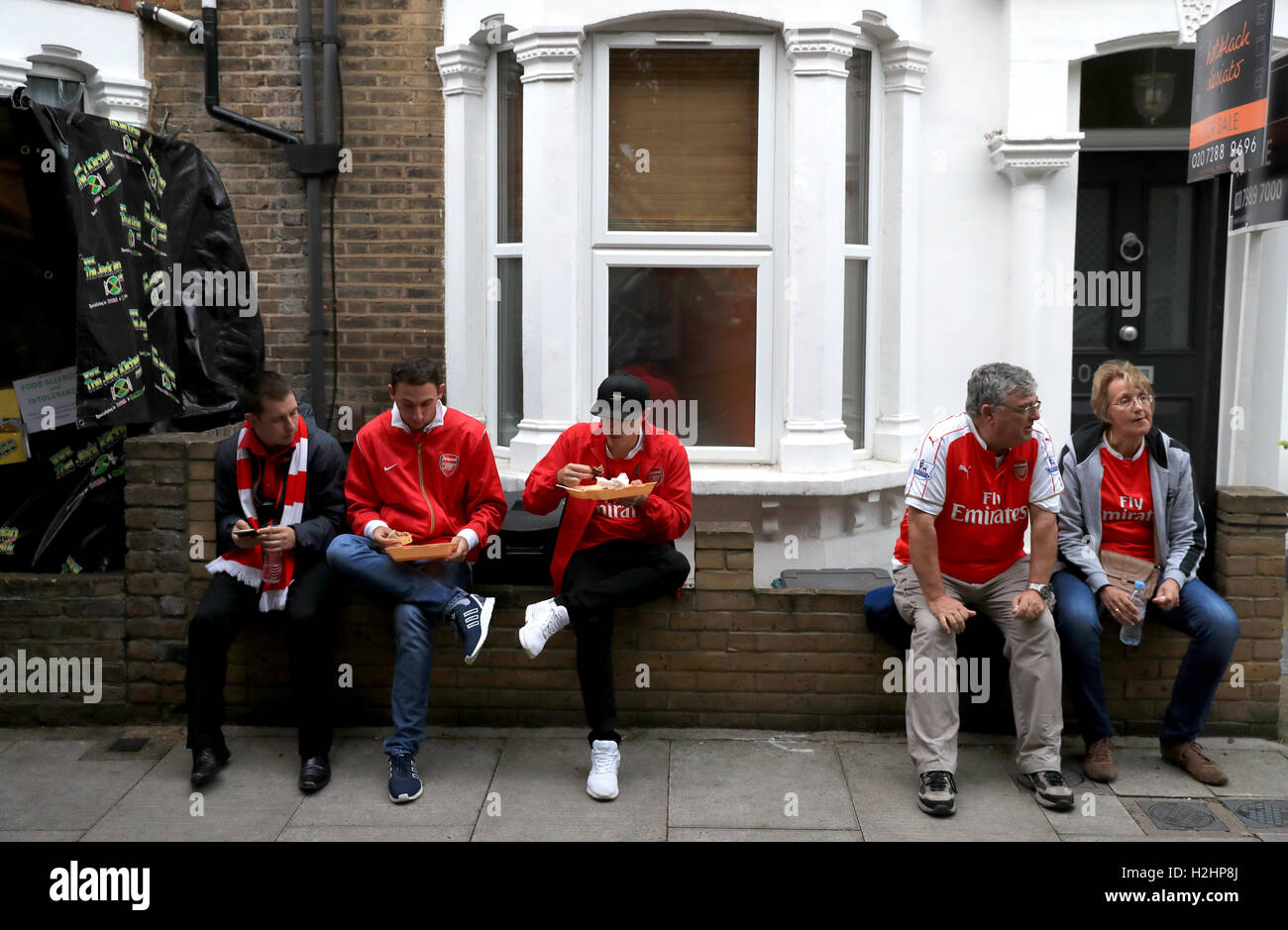 Arsenal fans grab a bite to eat before the UEFA Champions League, Group ...