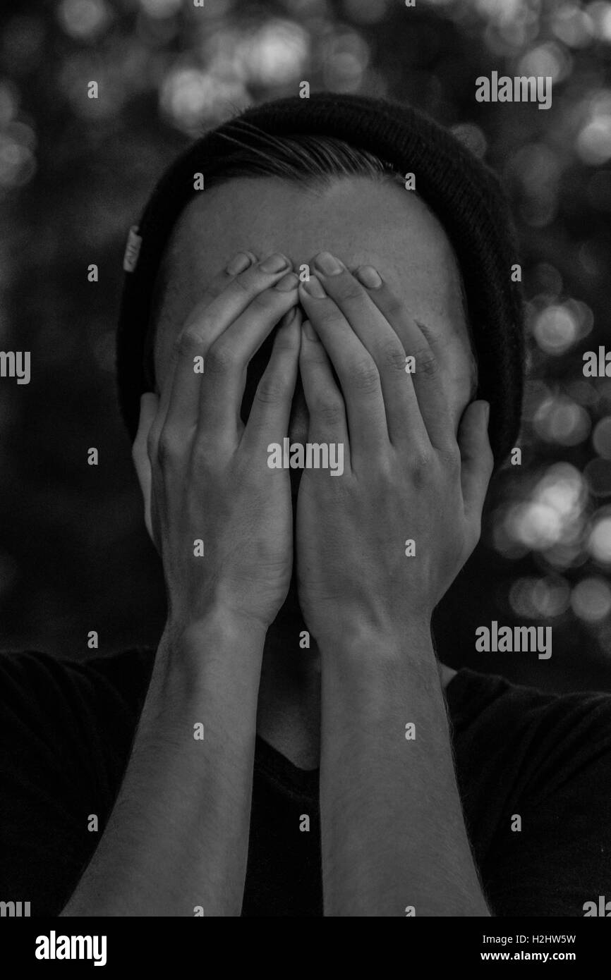 Boy hands over face hi-res stock photography and images - Alamy