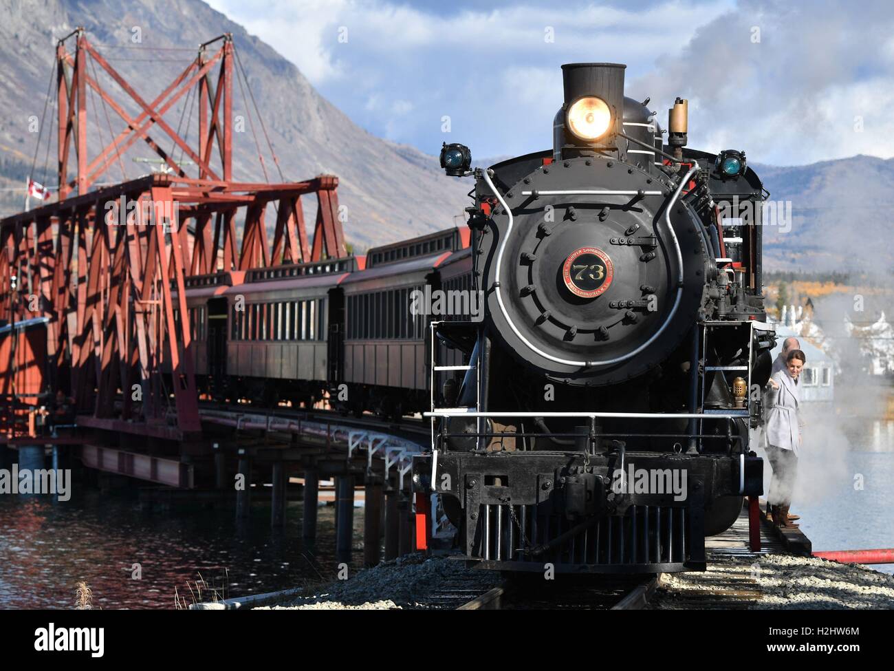 The Duke and Duchess of Cambridge walks beside a steam train in ...