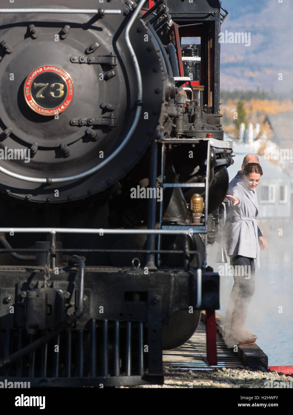 The Duke and Duchess of Cambridge walk alongside a steam train in ...
