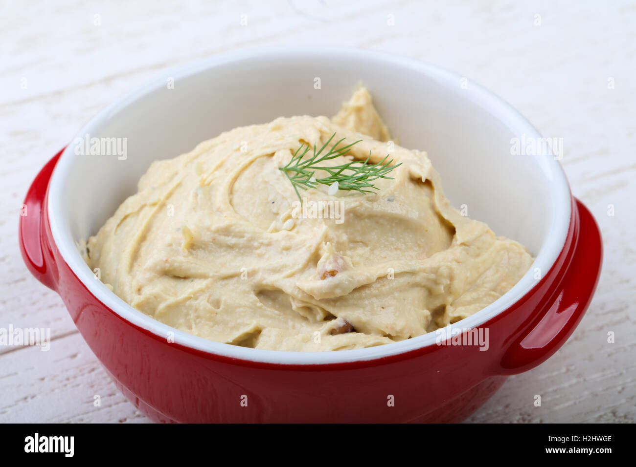 Arabic traditional cuisine - hummus with herbs and spices Stock Photo ...