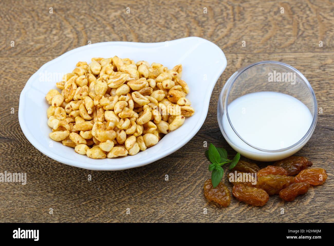 Rise flakes with milk, raisin and mint leaves Stock Photo - Alamy