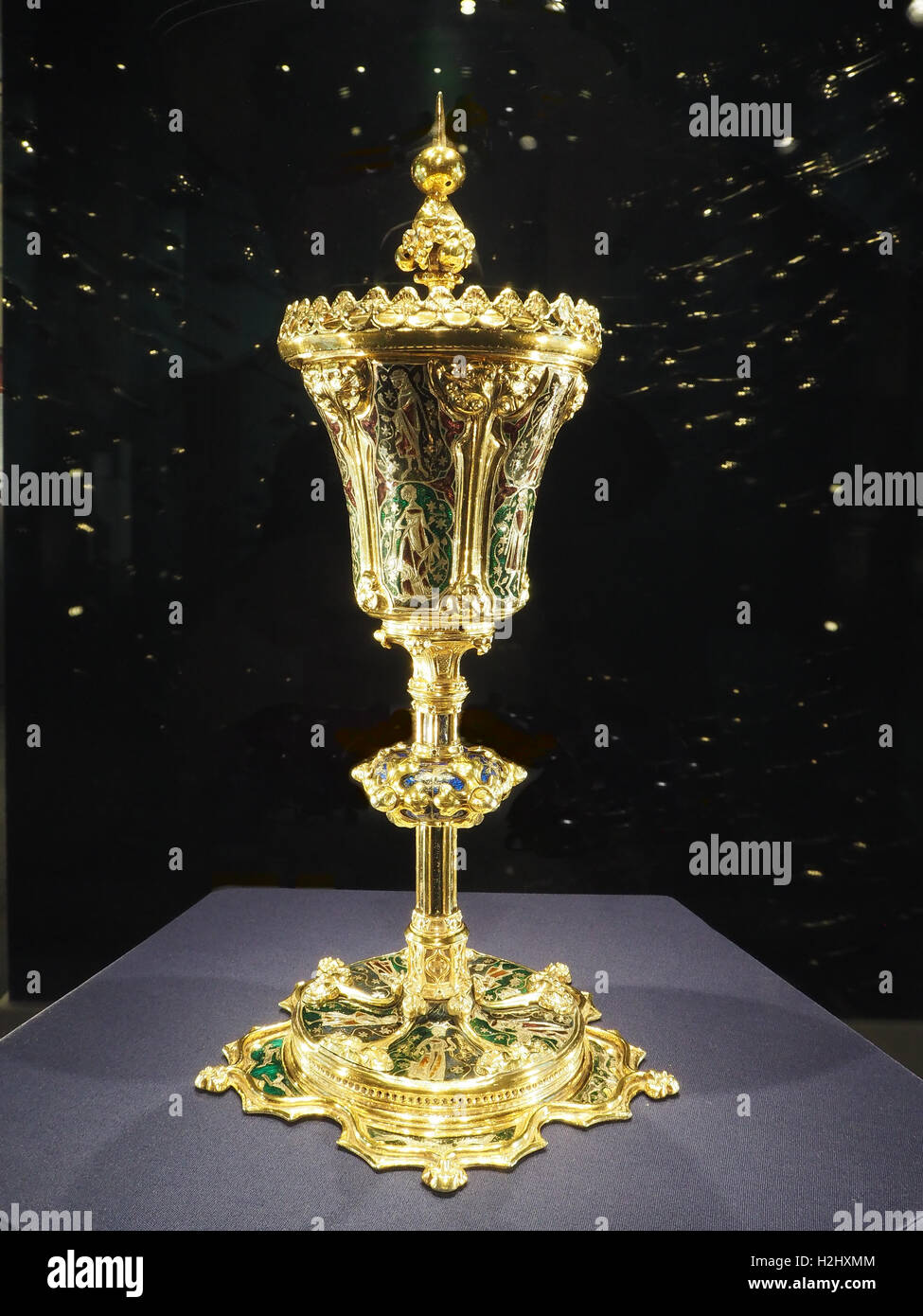 Gold challis or cup with a black/gold background Stock Photo - Alamy
