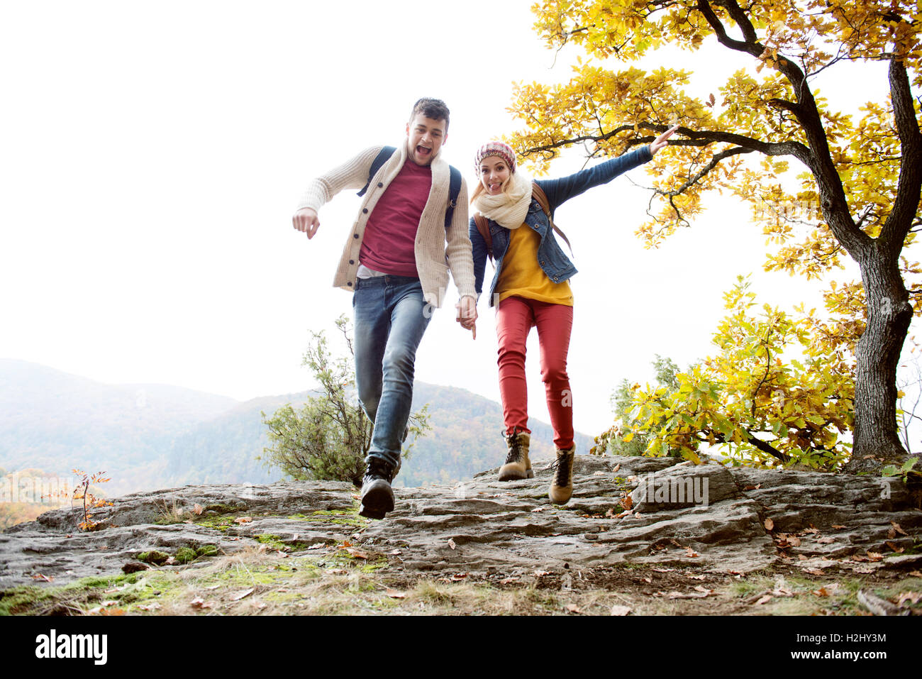 Romantic couple running together in hi-res stock photography and images ...