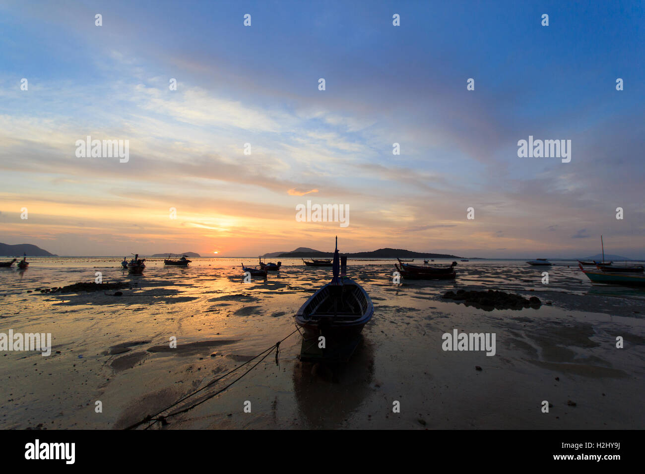 Beautiful sunrise in Rawai Phuket island Thailand with Long tailed boat ...