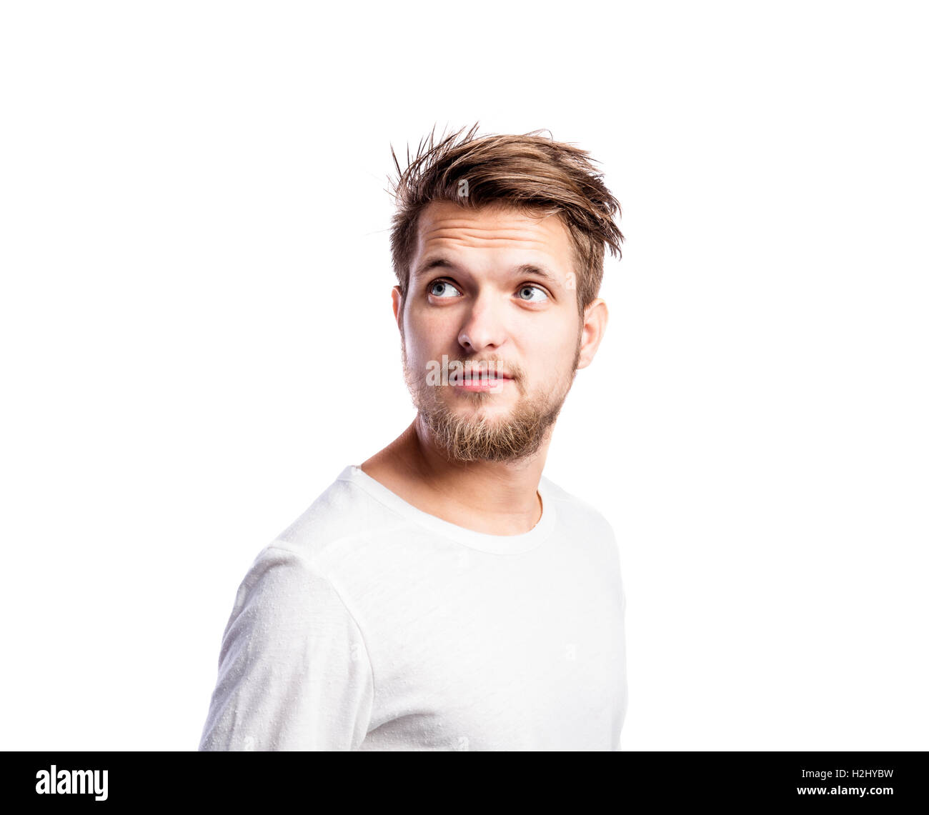 Hipster man in white t-shirt, studio shot, isolated Stock Photo - Alamy