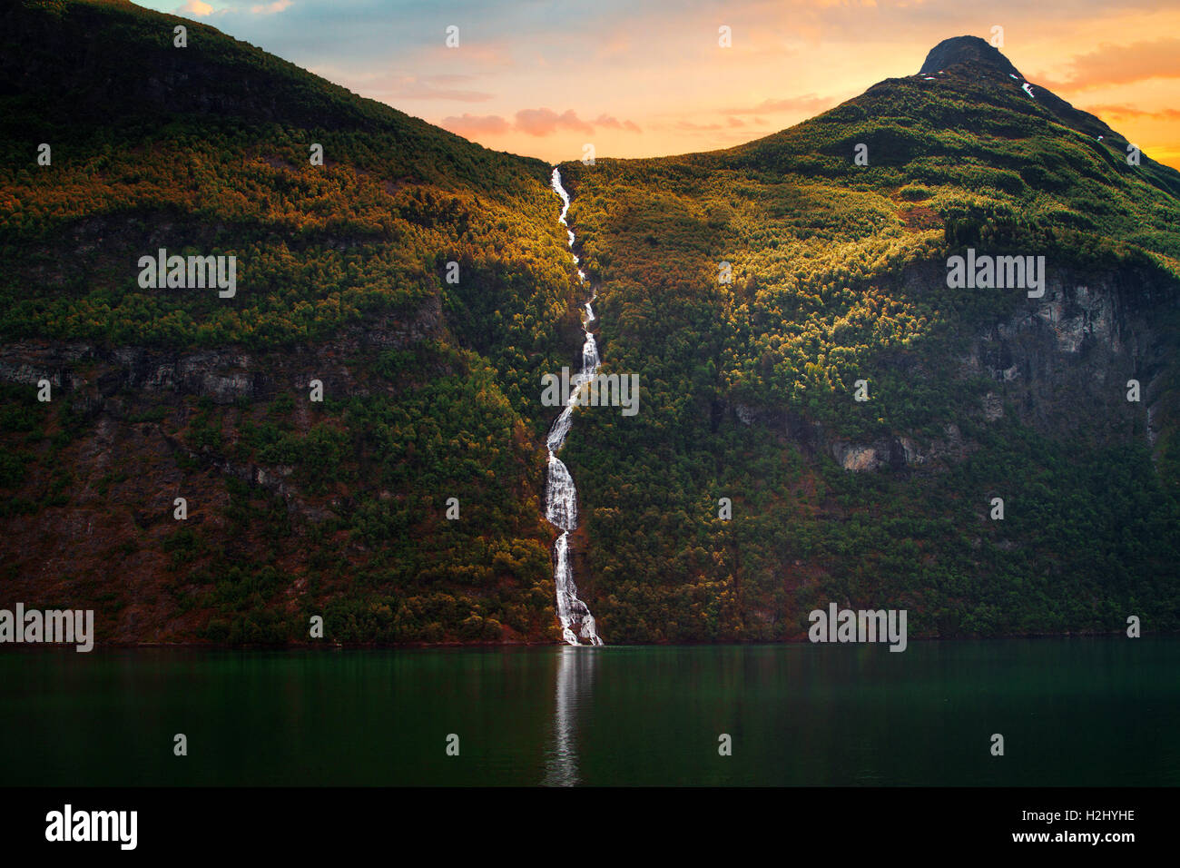 Waterfall over the Geiranger fjord, Norway Stock Photo - Alamy
