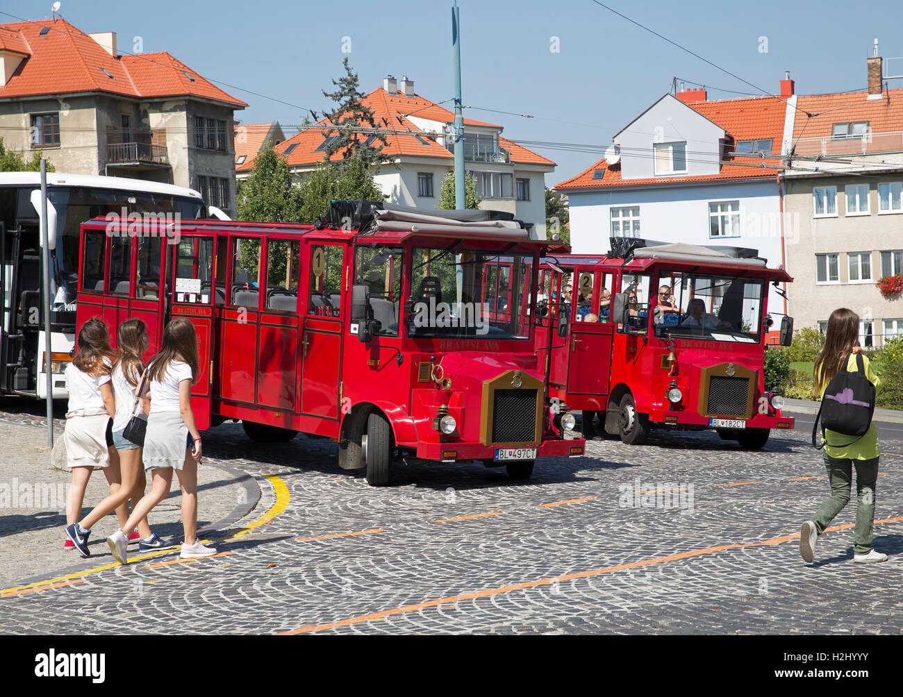 Old fashioned red tour buses outside Bratislava Castle in Slovakia ...