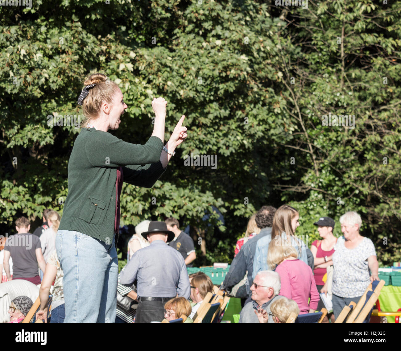 Female signer using sign language for people with impaired hearing at ...