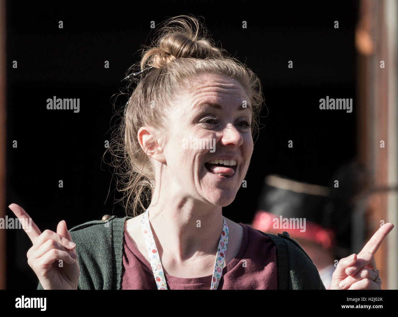 Female signer using sign language for people with impaired hearing at ...