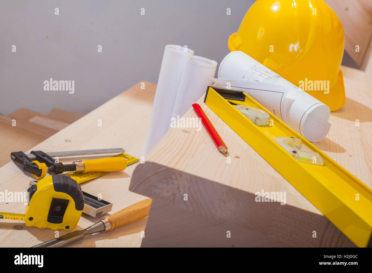 view on set of working tools on steps of wooden ladder Stock Photo - Alamy
