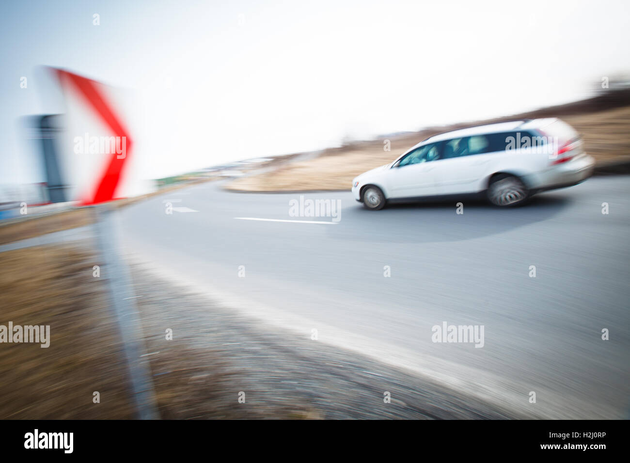 Traffic concept: car driving fast through a sharp turn Stock Photo - Alamy