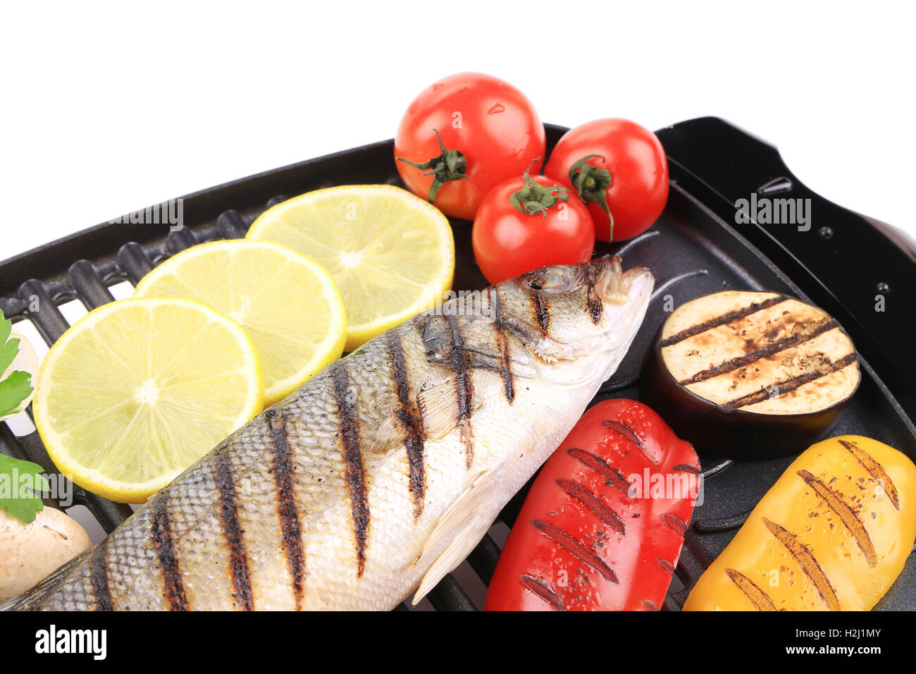 Grilled fish with vegetables Stock Photo - Alamy