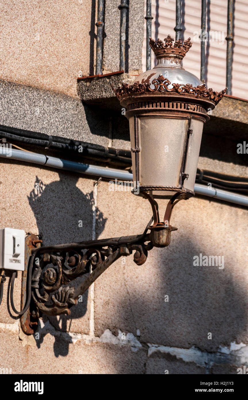 Street light on stone wall, spain Stock Photo - Alamy