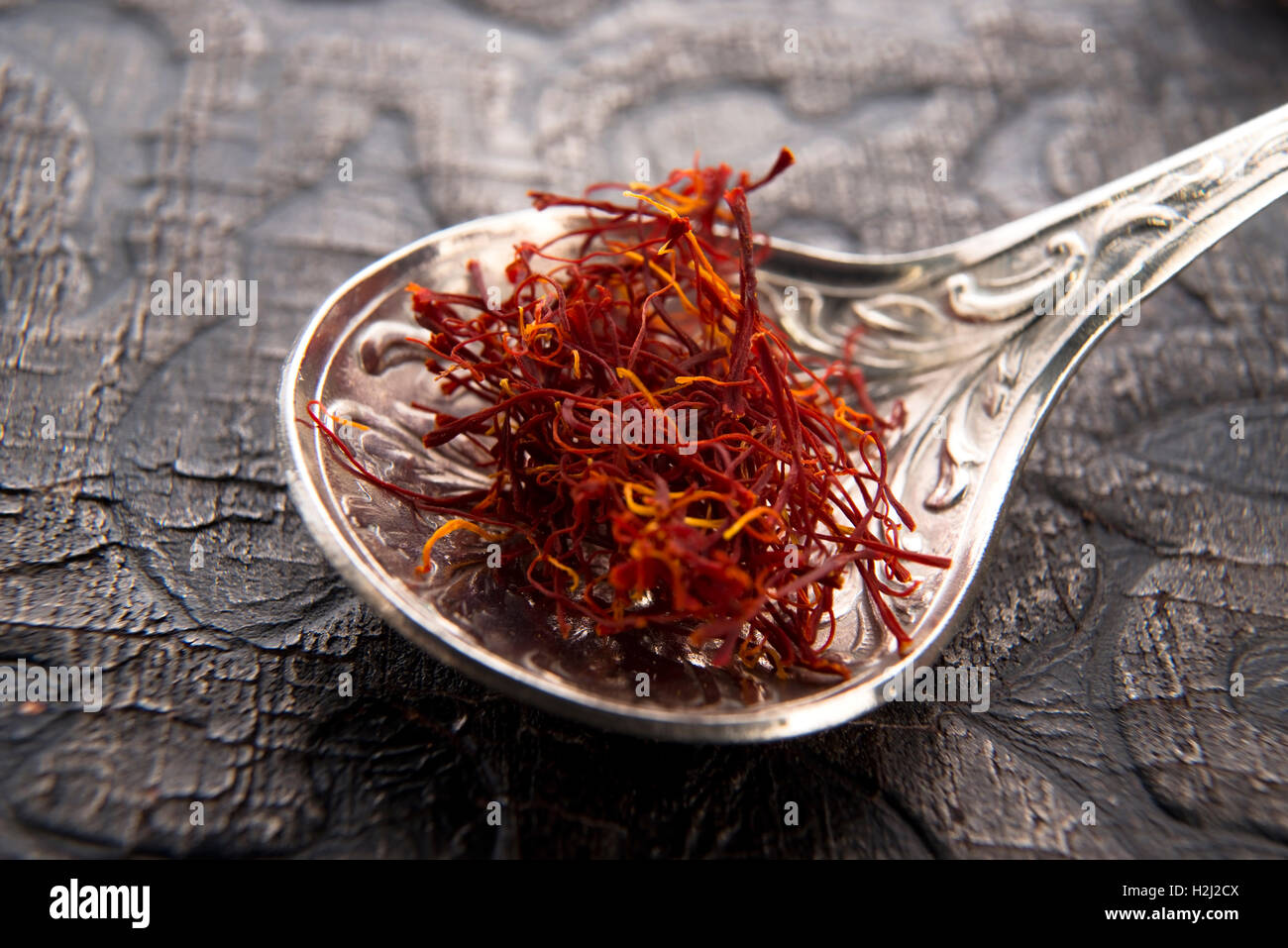 stigmas of saffron in spoon Stock Photo - Alamy