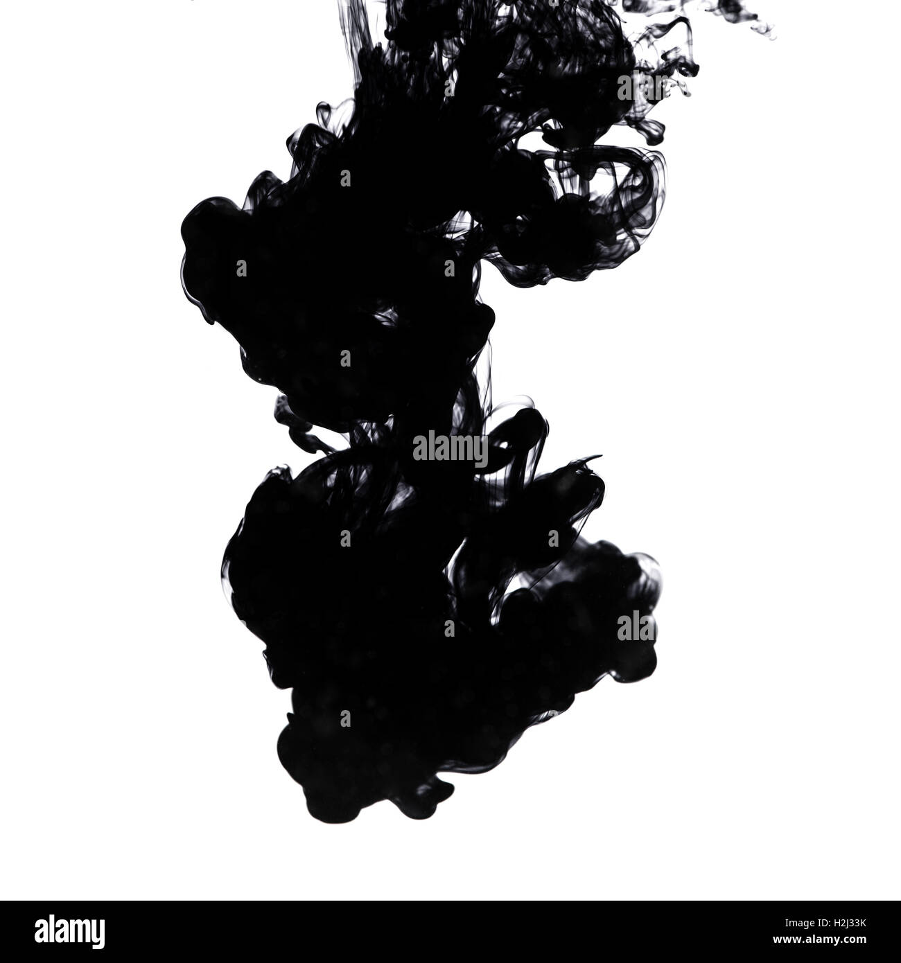 Ink in water on white background Stock Photo - Alamy
