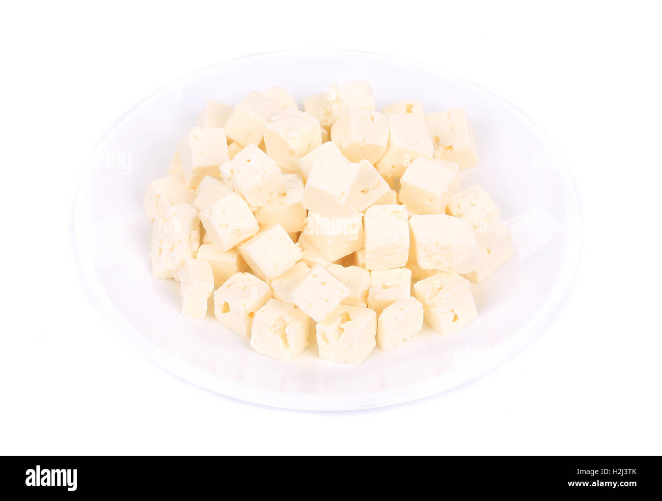 Soft cheese cubes on plate Stock Photo - Alamy