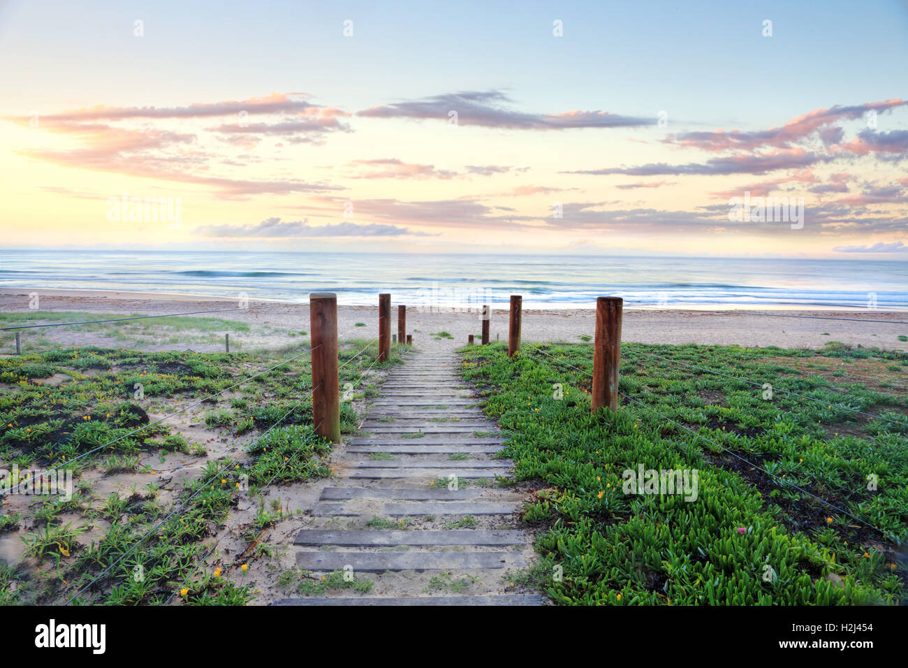 Path that refreshes the soul. Beach sunrise Australia Stock Photo - Alamy