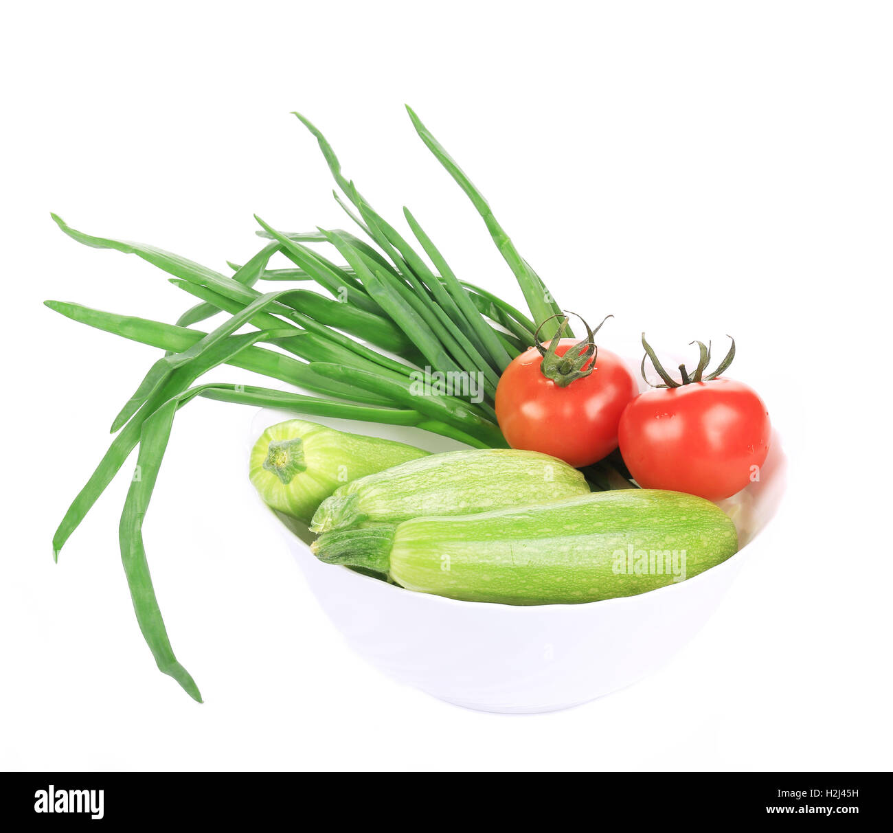 Courgettes, spring onions and tomatoes Stock Photo - Alamy