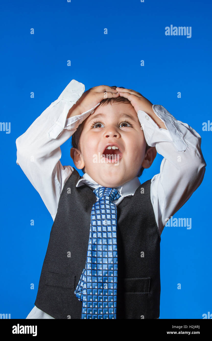 Leader, cute little boy portrait over blue chroma background Stock ...