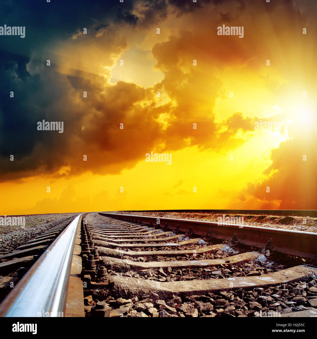 cloudy sunset over railroad Stock Photo - Alamy