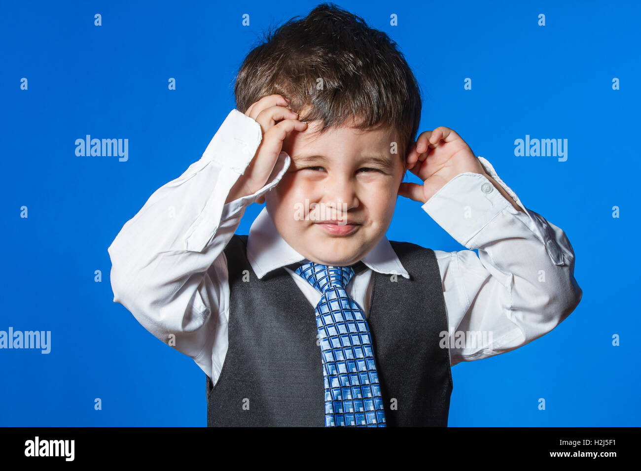 Leader, cute little boy portrait over blue chroma background Stock ...
