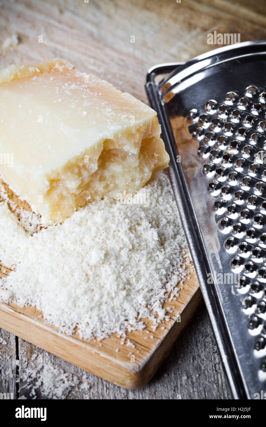 grated parmesan cheese and metal grater Stock Photo - Alamy
