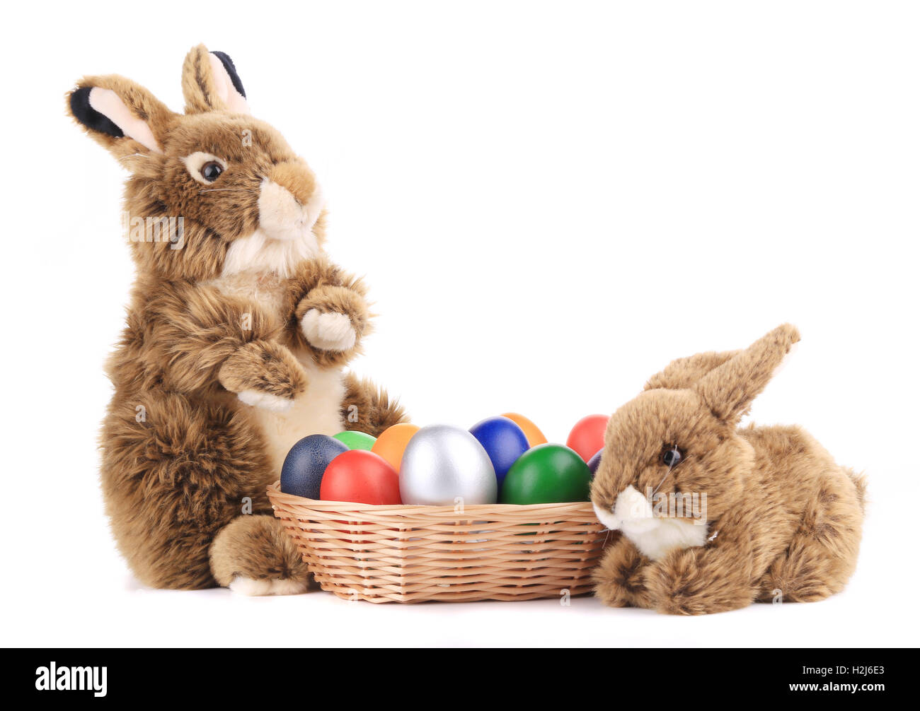Fluffy foxy rabbit in basket with Easter eggs Stock Photo - Alamy