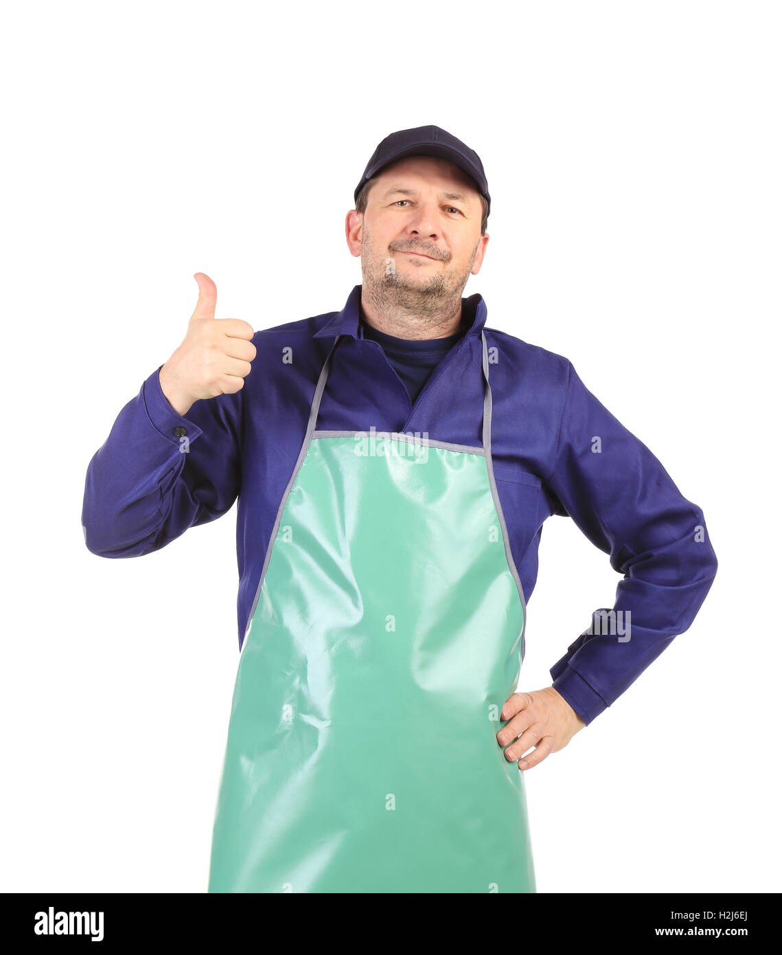 Smiling man dressed in apron Stock Photo - Alamy