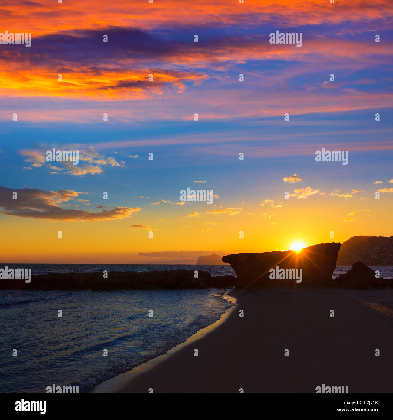 Calpe Alicante sunset at beach Cantal Roig in Spain Stock Photo - Alamy