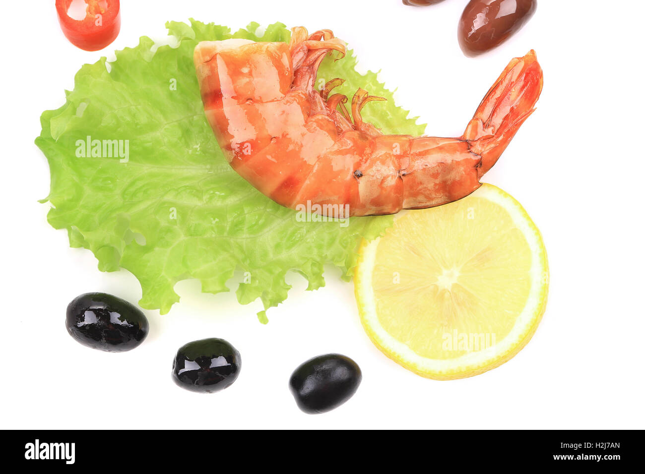 Two shrimp with lemon Stock Photo - Alamy