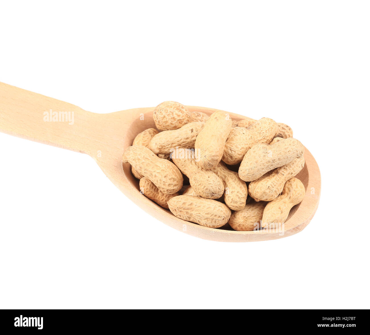 Wooden spoon with peanuts Stock Photo - Alamy