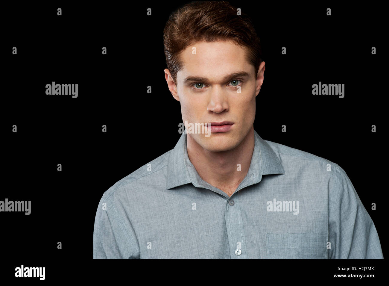 Confident young smart guy Stock Photo - Alamy