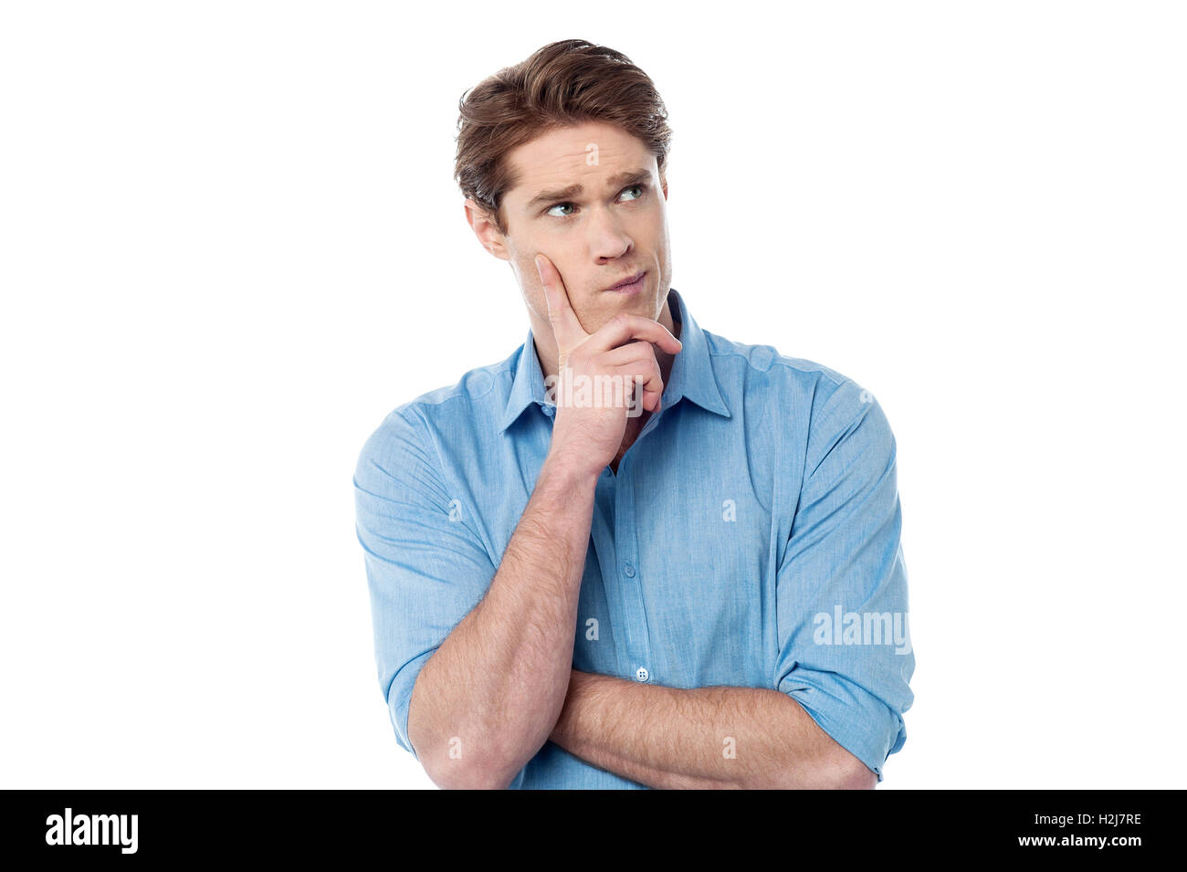Young man thinking something Stock Photo - Alamy