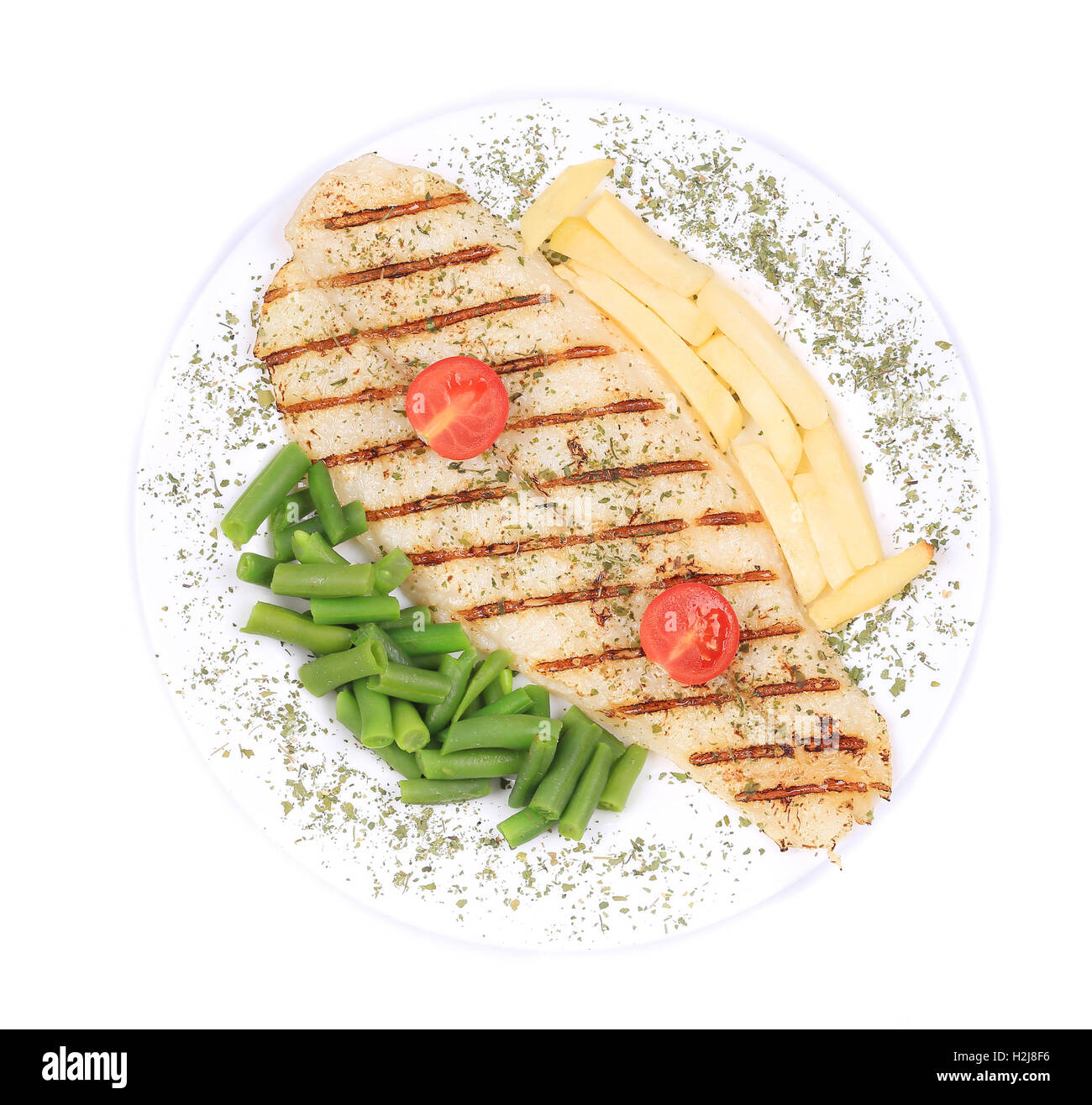 Fish fillet with french fries and herbs Stock Photo - Alamy