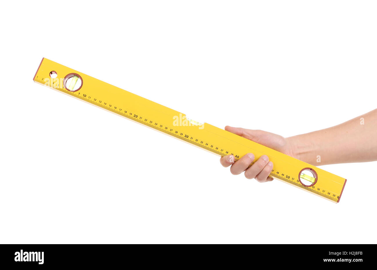 Yellow level tool in hand Stock Photo - Alamy